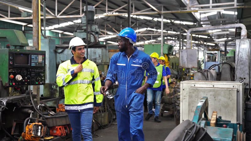 Engineers and Employees Walk Inside the Factory at Break. Engineers and ...