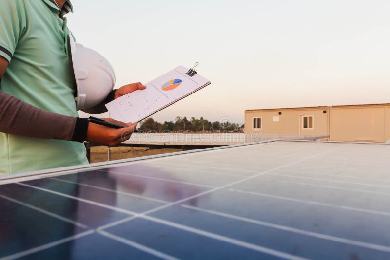 Engineers are Examining the Performance Graph of Energy Production from ...