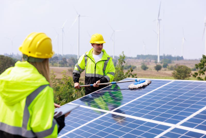 Engineers Examining Solar Panel Using Digital Taplet Computer in Solar ...