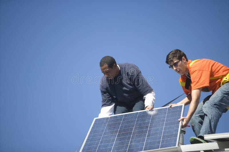 Man Fixing Solar Panel on Rooftop Stock Photo - Image of palm ...