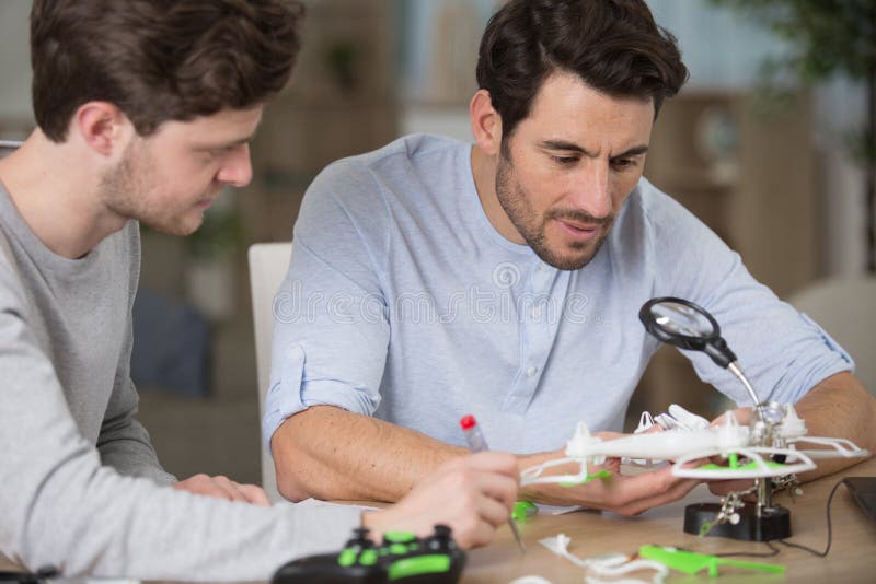 Engineers Fixing Square Copter at Table Stock Photo - Image of inside ...
