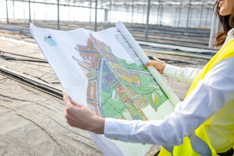 Engineers at the Greenhouse Construction Site Scrutinizing a ...