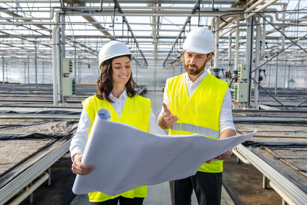 Engineers at the Greenhouse Construction Site Scrutinizing a ...