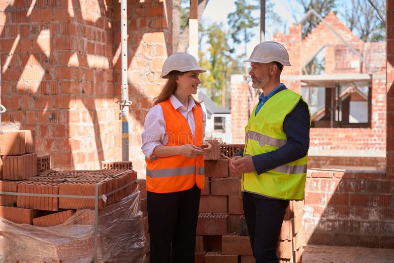 Engineers in Hardhats Counting Received Bricks and Discussing Building ...