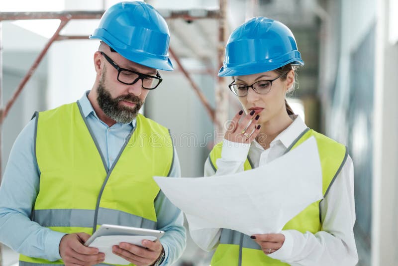Engineers in Hardhats Have Conversation Stock Photo - Image of engineer ...