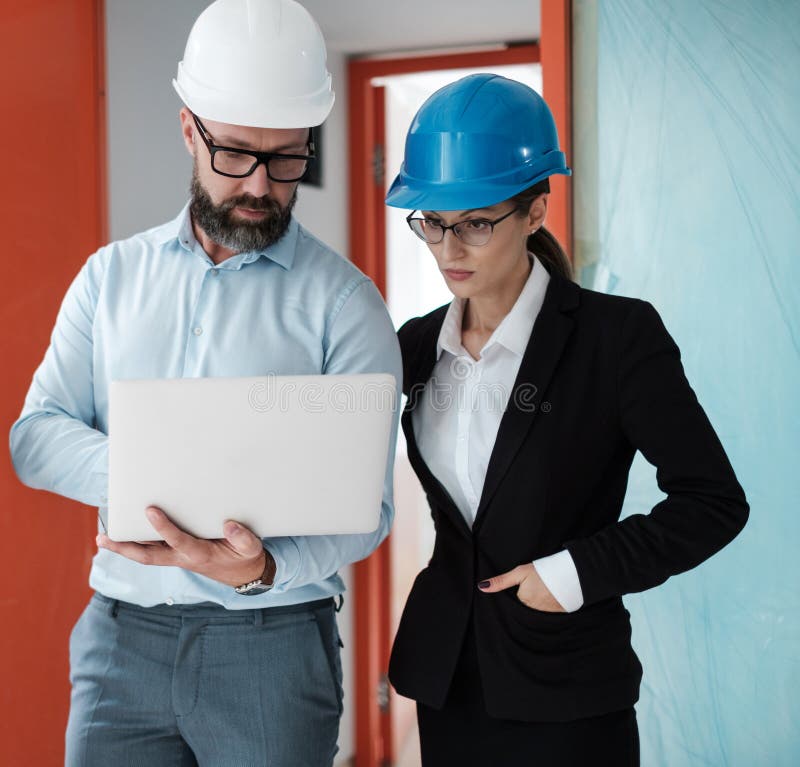 Engineers in Hardhats Have Conversation Stock Photo - Image of helmet ...