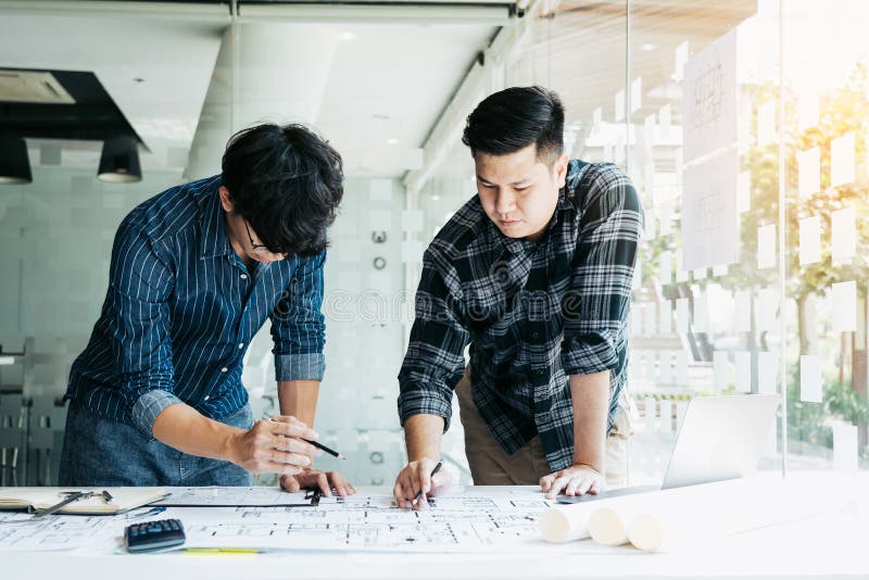 Engineers are Helping To Design Work on Blueprints and Collaborate on ...