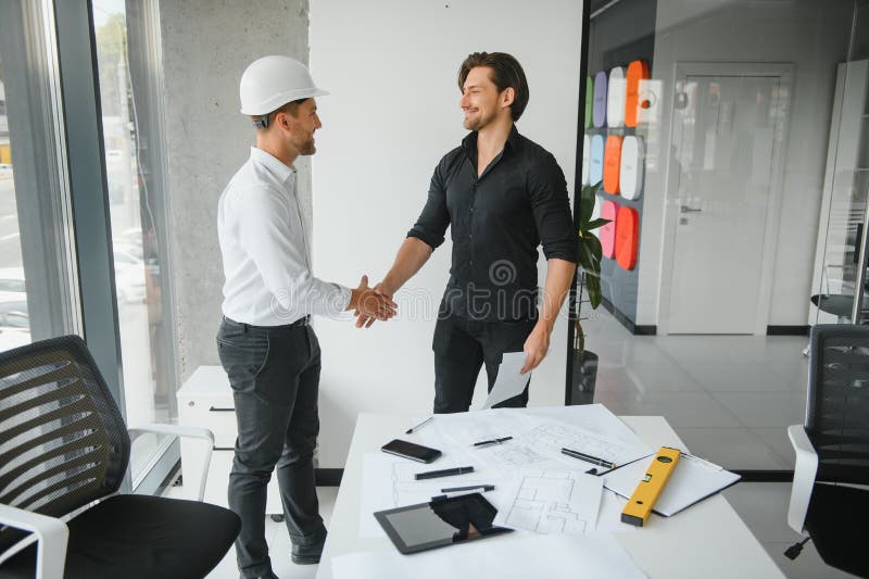 Engineers are Helping To Design Work on Blueprints and Collaborate on ...