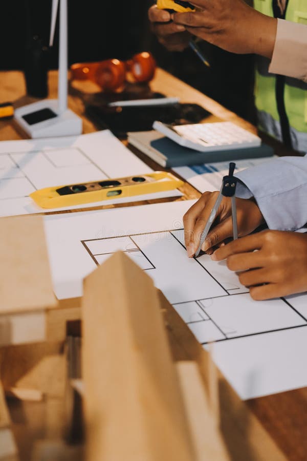 Engineers are Helping To Design Work on Blueprints and Collaborate on ...