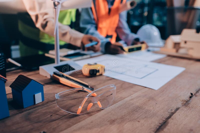 Engineers are Helping To Design Work on Blueprints and Collaborate on ...