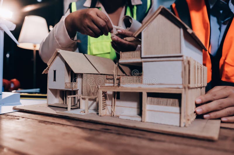 Engineers are Helping To Design Work on Blueprints and Collaborate on ...