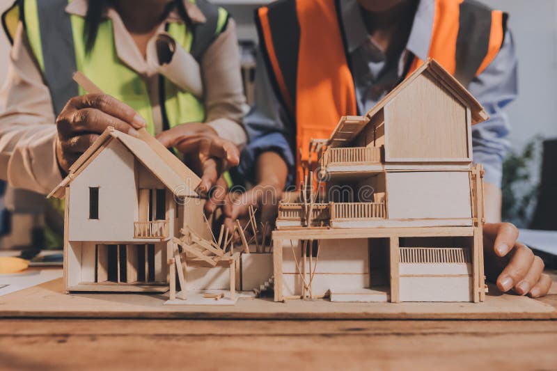 Engineers are Helping To Design Work on Blueprints and Collaborate on ...