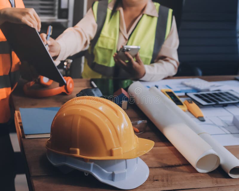 Engineers are Helping To Design Work on Blueprints and Collaborate on ...