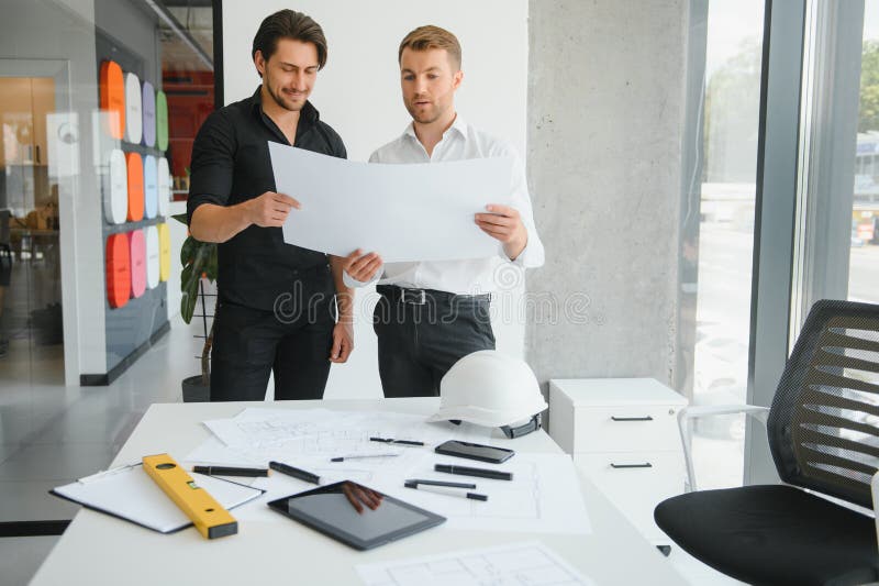 Engineers are Helping To Design Work on Blueprints and Collaborate on ...