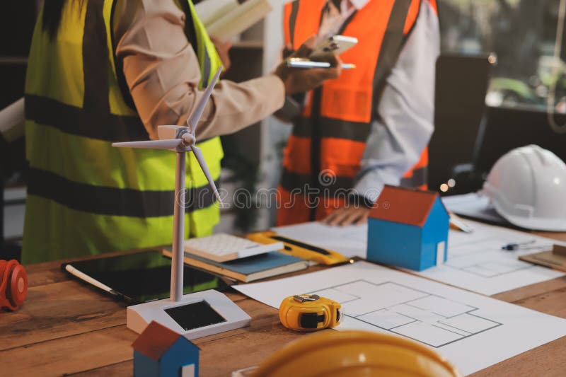 Engineers are Helping To Design Work on Blueprints and Collaborate on ...