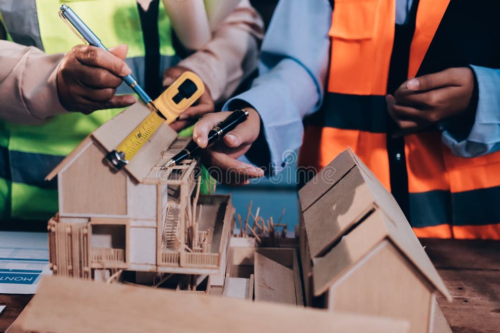 Engineers are Helping To Design Work on Blueprints and Collaborate on ...