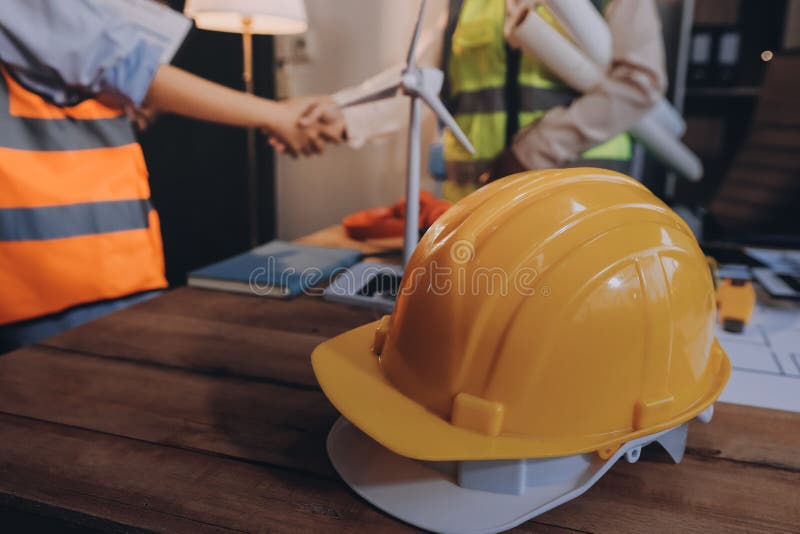 Engineers are Helping To Design Work on Blueprints and Collaborate on ...