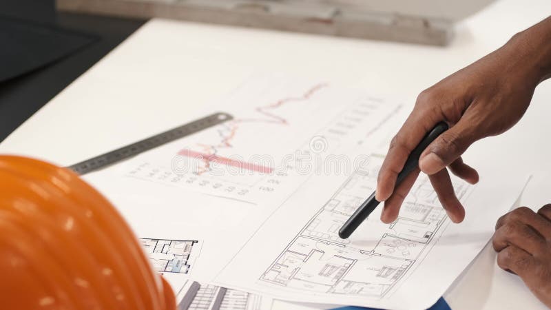 A Group of Engineers are Looking at a Blueprint for Construction on the ...