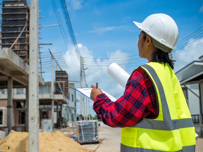 Engineers Holding Blueprint Project Working Outdoors Building Side with ...