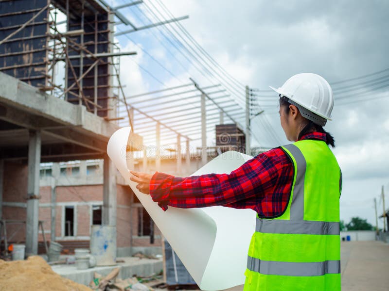 Engineers Holding Blueprint Project Working Outdoors Building Side with ...