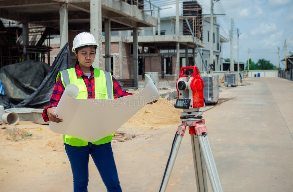 Engineers Holding Blueprint Project Working Outdoors Building Side with ...