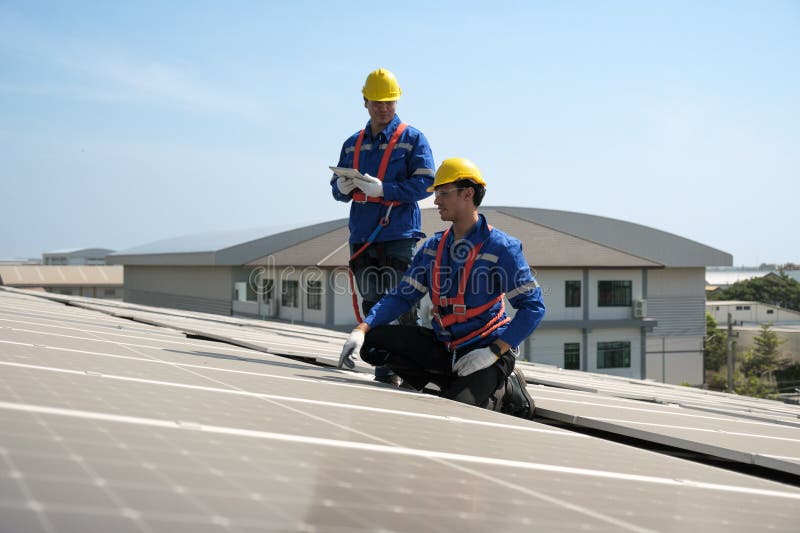 Engineers Install Solae Cell on the Roof of Factory Stock Image - Image ...