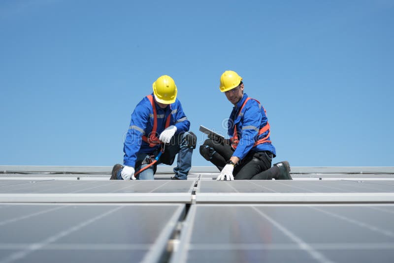 Engineers Install Solae Cell on the Roof of Factory Stock Image - Image ...