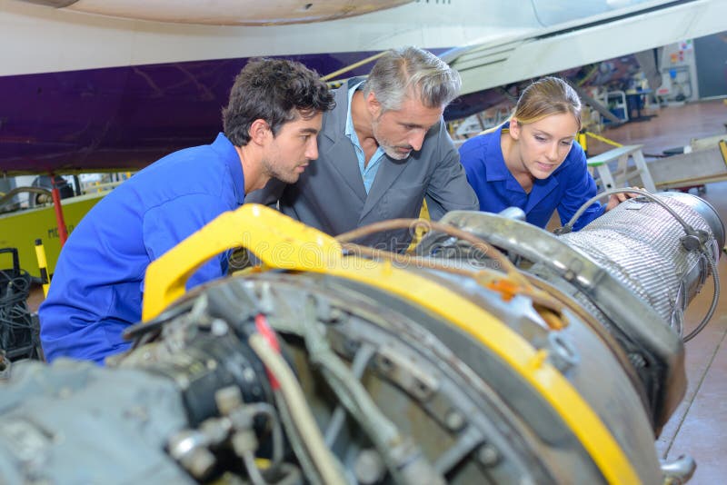 Engineers Looking at Aircraft Component Stock Photo - Image of business ...