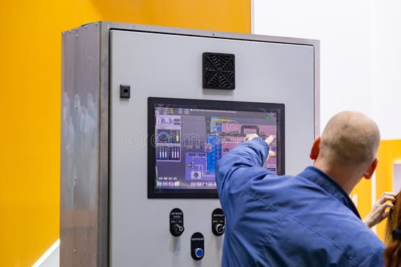 Engineers Maintaining Industrial Control Panel with Monitoring System ...