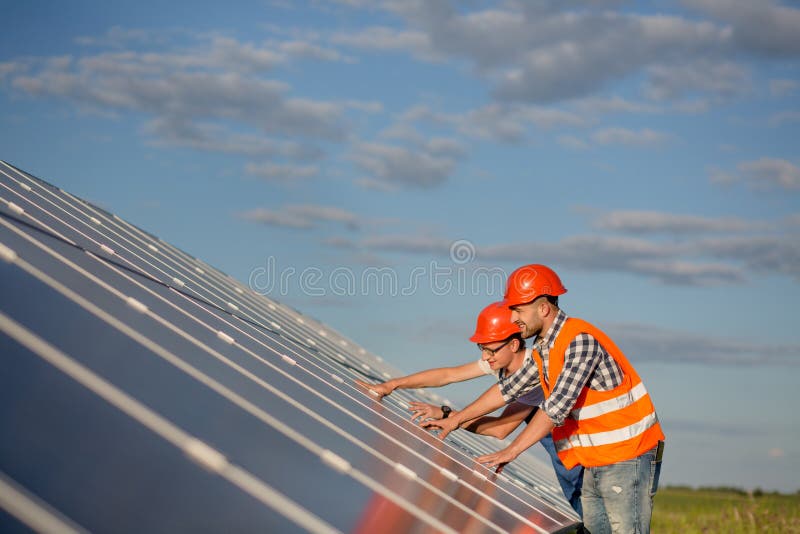 Engineers Maintaining Solar Panels in the Field. Stock Photo - Image of ...