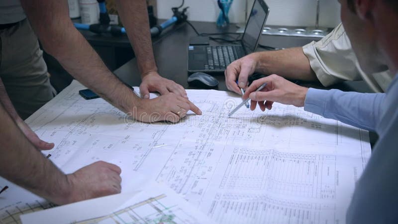 Engineers and Managers in the Conference Room Discuss Drawings and ...
