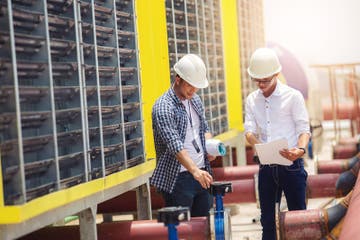 Engineers in Mechanical Factory Reading Instructions Stock Image ...