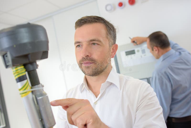 Engineers Operating Machine Stock Image - Image of technician, control ...