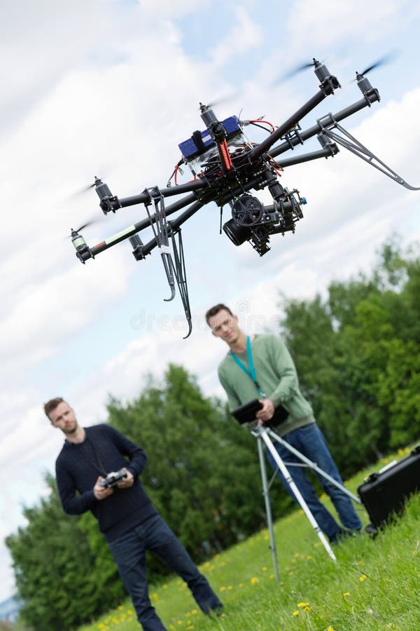 Engineers Operating UAV Helicopter Stock Photo - Image of feed ...