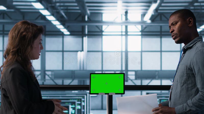 Engineers Overseeing Server Room with Mockup Device, Reading Documentation Stock Footage - Video ...