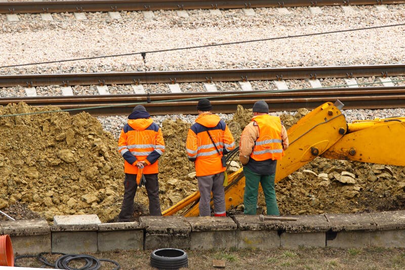 Engineers Digging a New Fibre Cable into the Ground Stock Image - Image ...