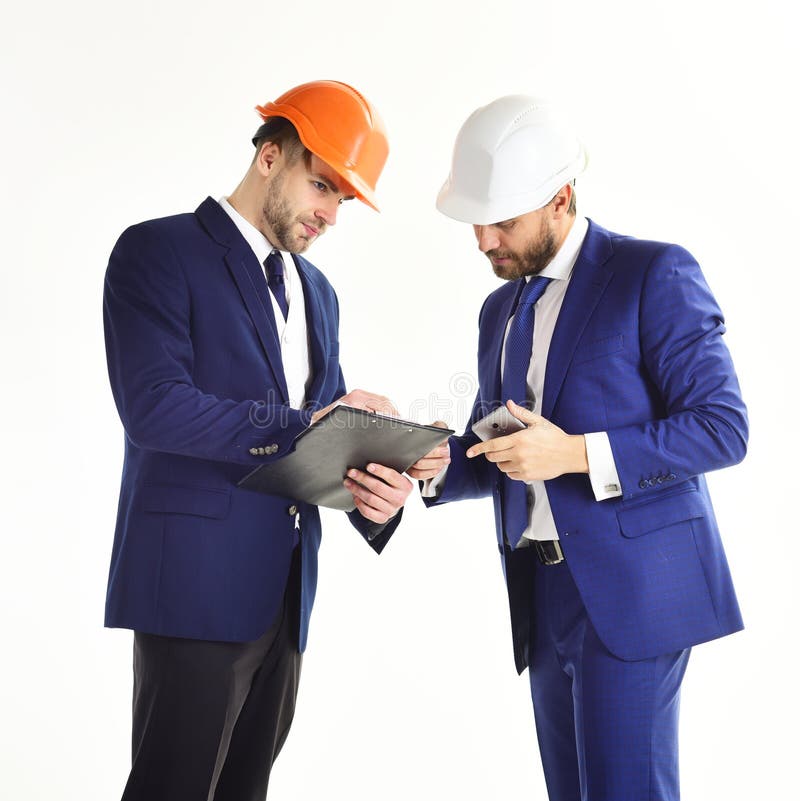 Engineers with Serious Faces. Entrepreneur and Architect with Plans and ...