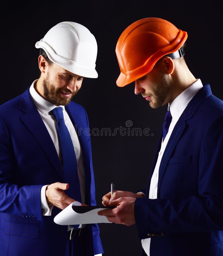 Engineers with Smiling Faces Look at Documents. Stock Image - Image of ...