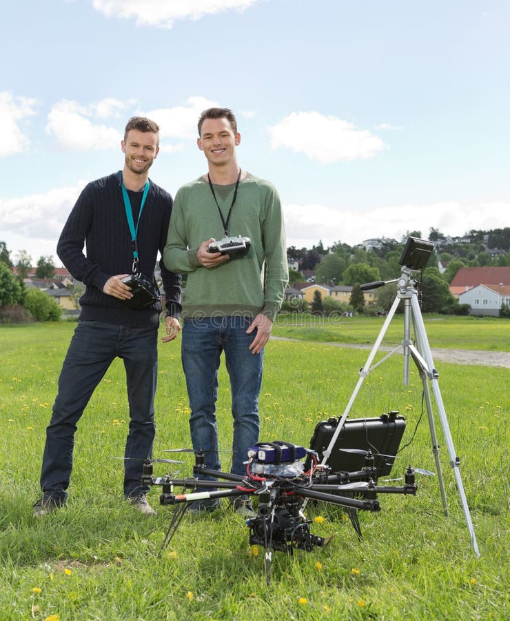 Engineers Standing by UAV Helicopter and Tripod Stock Image - Image of ...