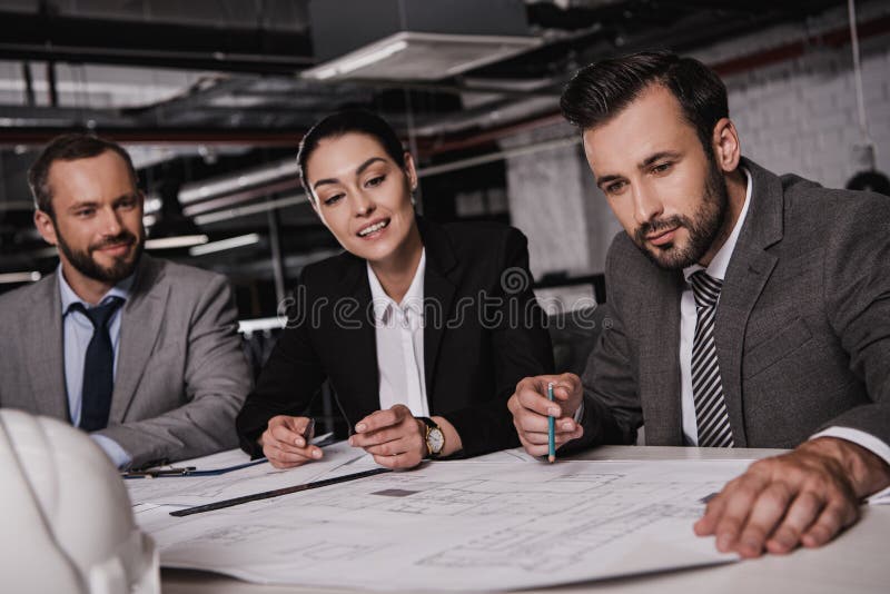 Engineers in suits working stock photo. Image of urban - 128983546