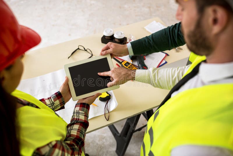 Engineers with Tablet at Construction Site Stock Image - Image of ...