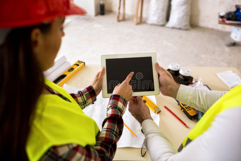Engineers with Tablet at Construction Site Stock Image - Image of ...