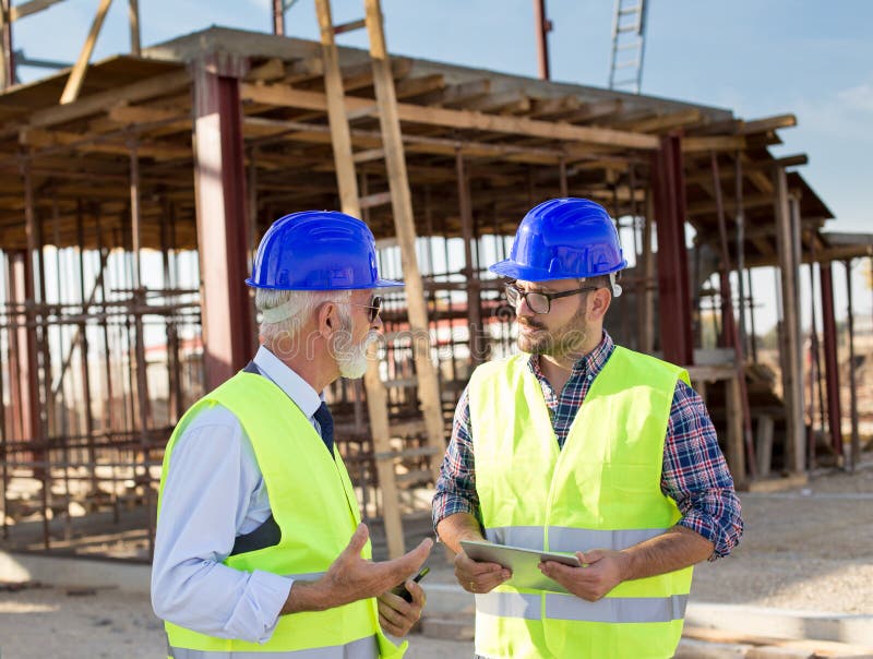 Engineers Talking at Building Site Stock Image - Image of construction ...