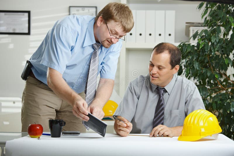 Engineers Talking at Office Stock Image - Image of blueprint ...