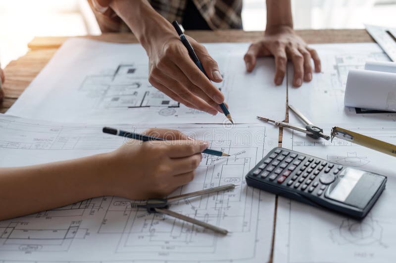 Engineers Team Close Up To Design Building Blueprints Paper for Clients ...