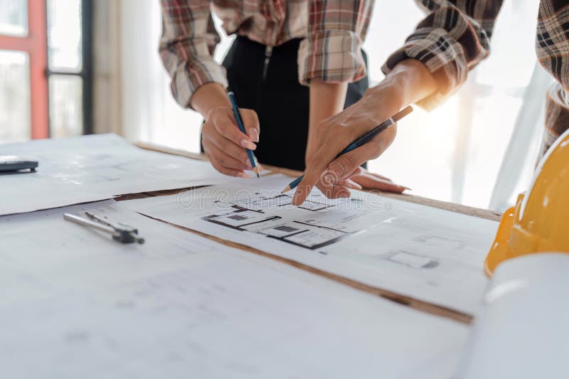 Engineers Team Close Up To Design Building Blueprints Paper for Clients ...