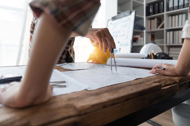 Engineers Team Close Up To Design Building Blueprints Paper for Clients ...