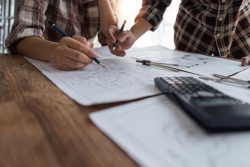 Engineers Team Close Up To Design Building Blueprints Paper for Clients ...