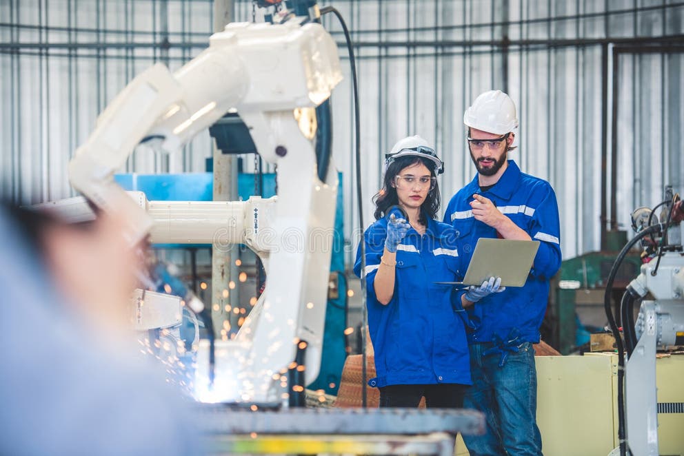 Engineers Team Mechanic Using Computer Controller Robotic Arm for ...