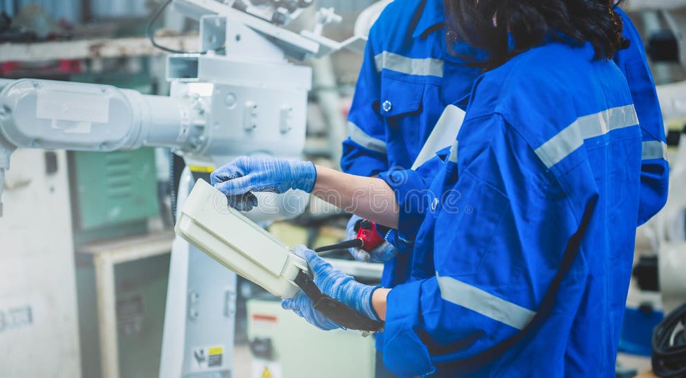 Engineers Team Mechanic Using Computer Controller Robotic Arm for ...